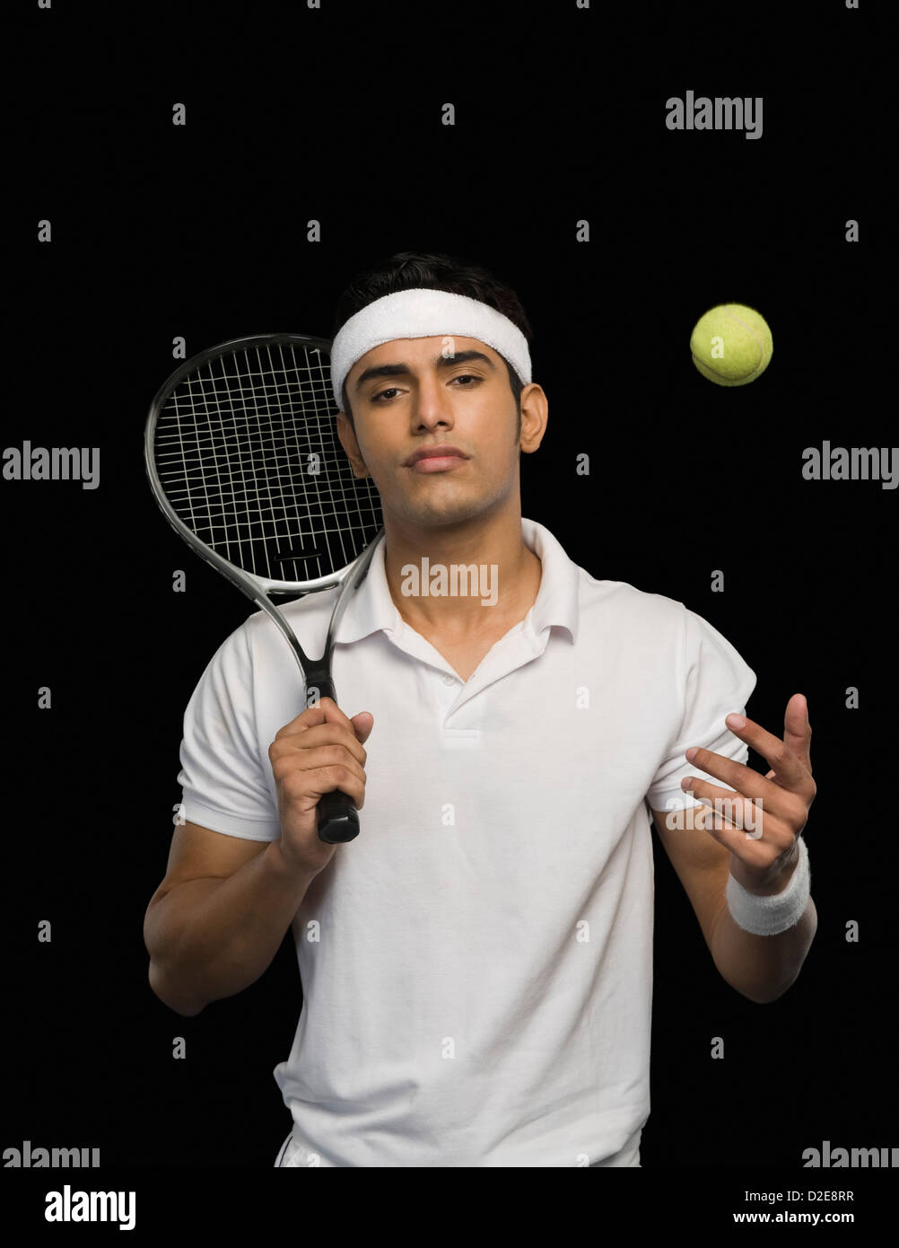 Tennis player with a tennis racket and a ball Stock Photo - Alamy