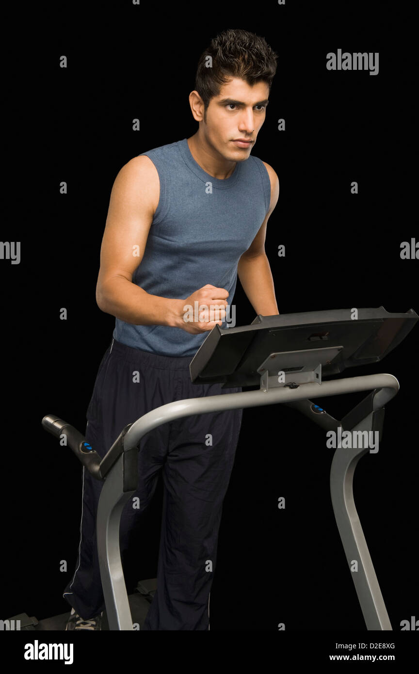 Man running on a treadmill Stock Photo - Alamy