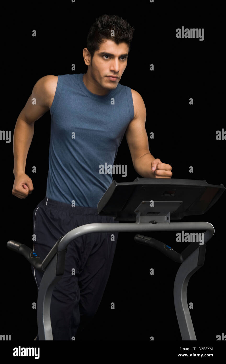 Man running on a treadmill Stock Photo - Alamy
