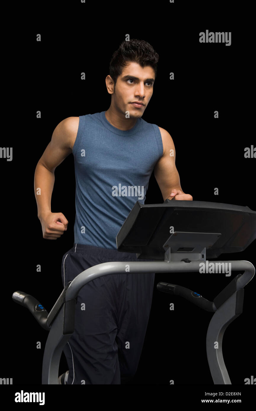 Man running on a treadmill Stock Photo - Alamy