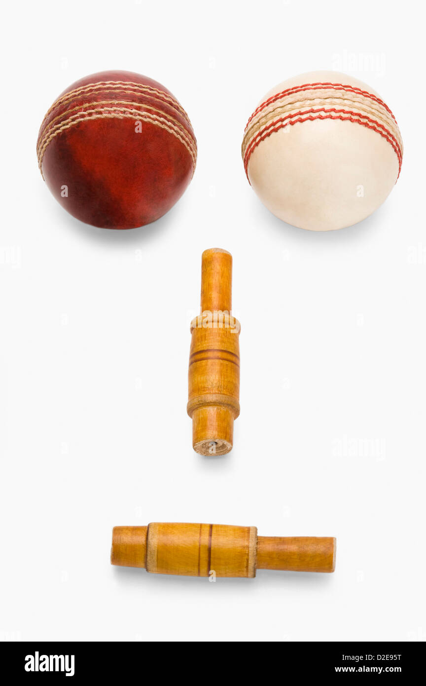 Cricket balls and bails forming an anthropomorphic face Stock Photo - Alamy