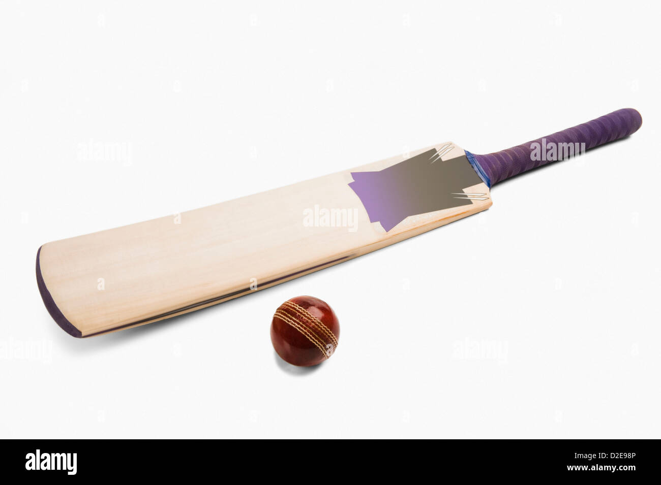 Close-up of a cricket ball with a bat Stock Photo - Alamy