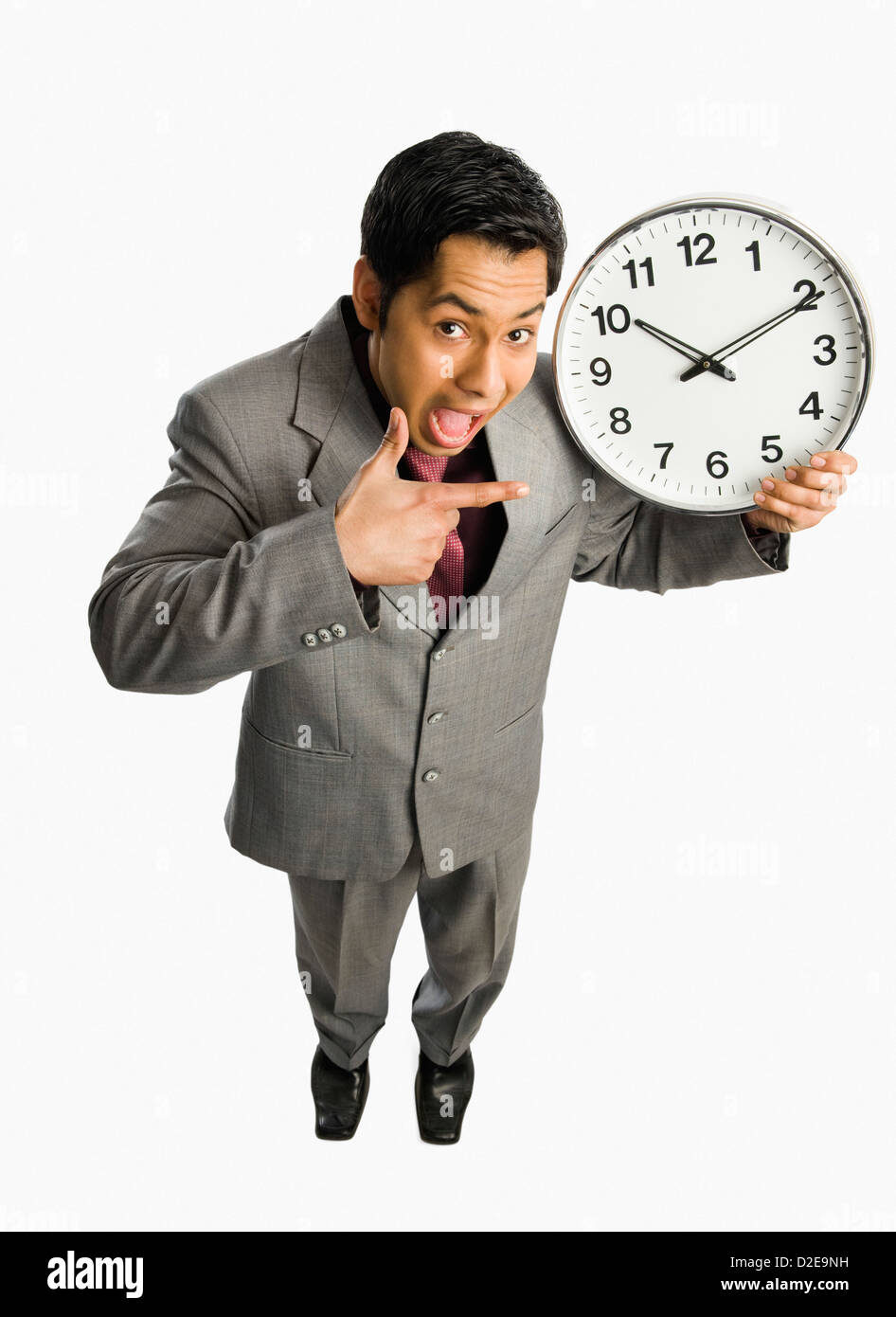 Businessman showing a clock Stock Photo - Alamy