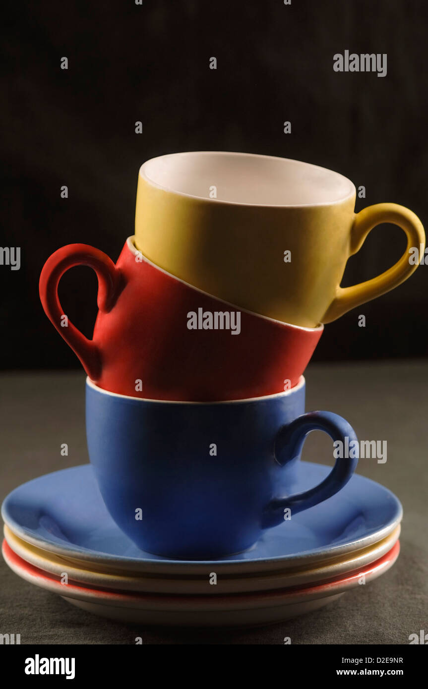 Stack of tea cups and saucers Stock Photo - Alamy