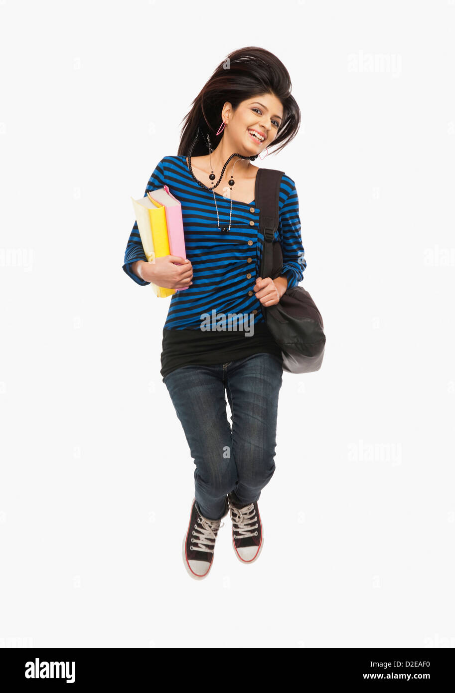 Female university student jumping Stock Photo - Alamy