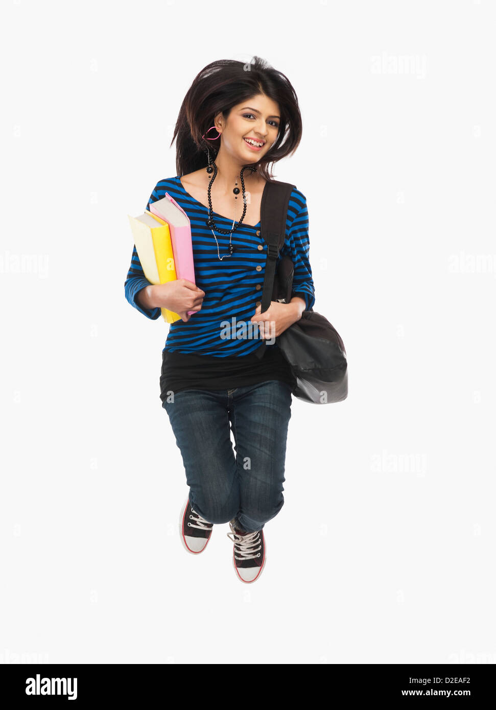 Female university student jumping Stock Photo - Alamy