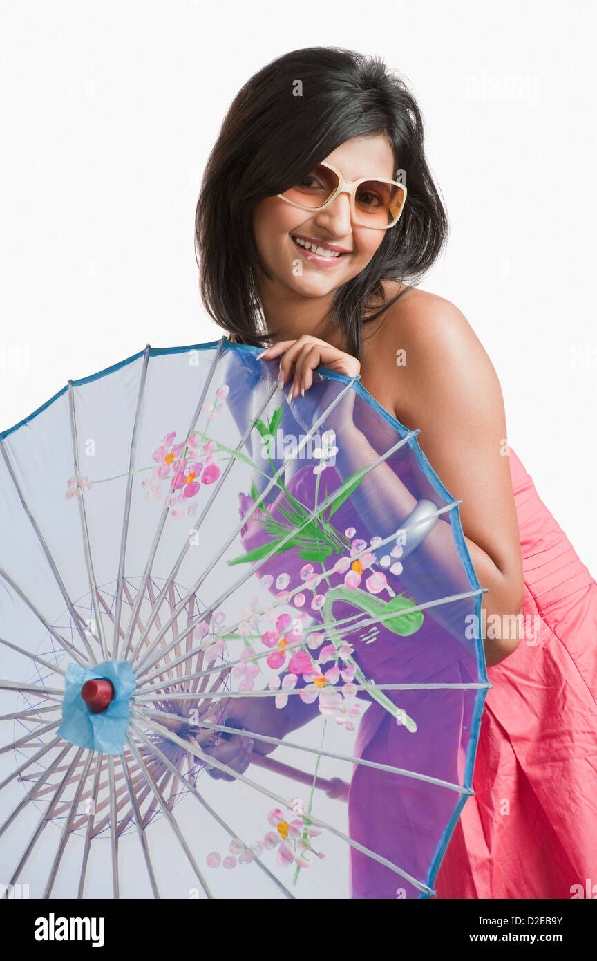 Woman standing holding parasol hi-res stock photography and images - Alamy