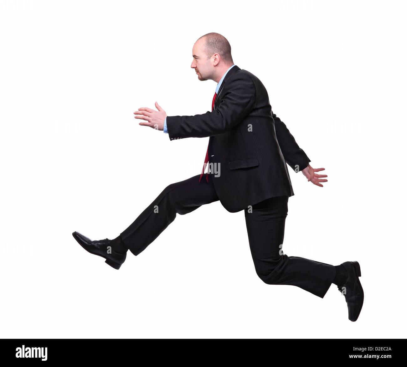 isolated businessman in running pose Stock Photo - Alamy