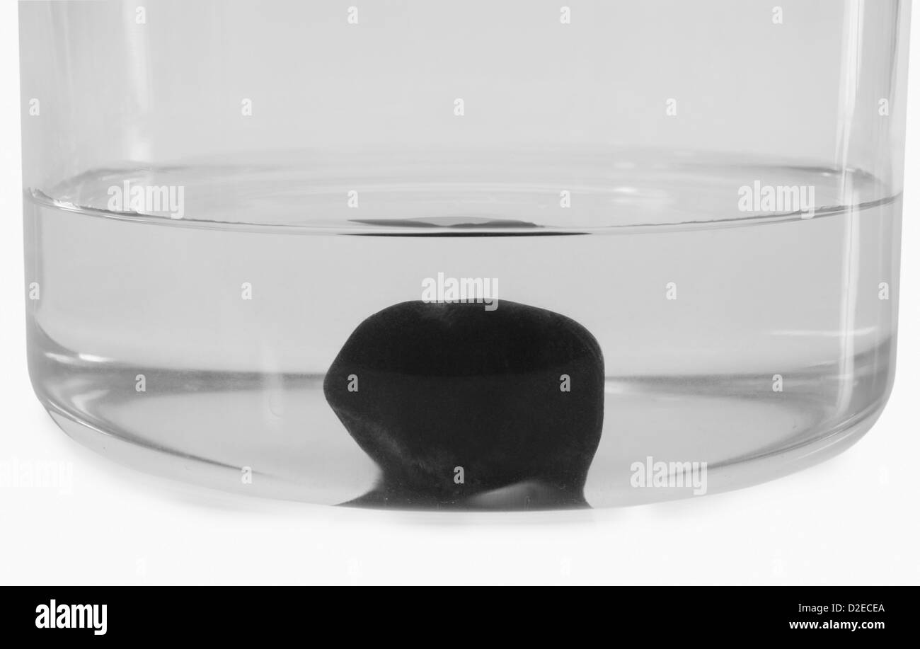 Stone sinking water hi-res stock photography and images - Alamy