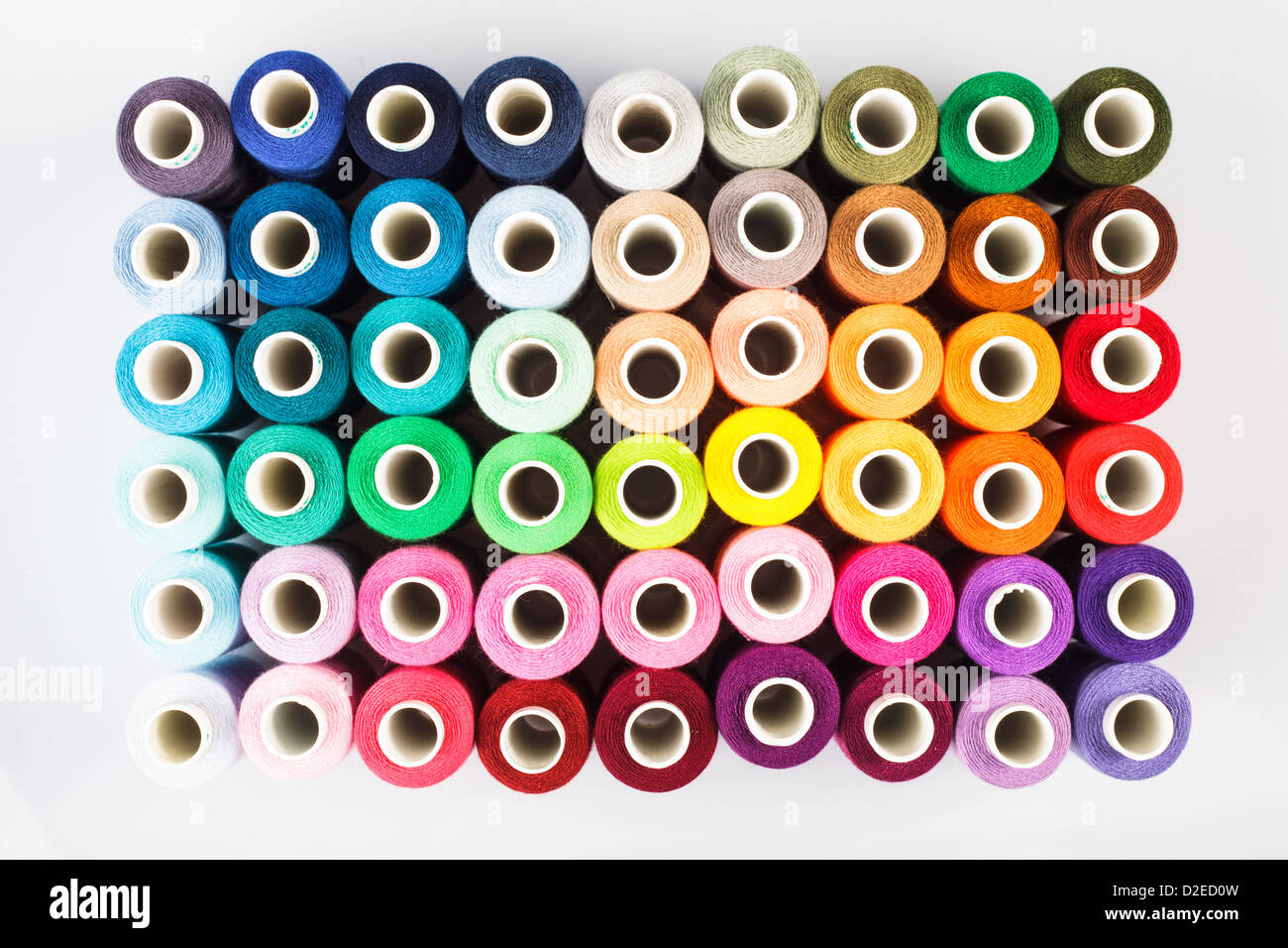 Sewing threads as a multicolored background closeup Stock Photo - Alamy
