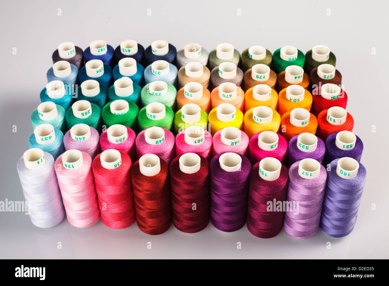Sewing threads as a multicolored background closeup Stock Photo - Alamy