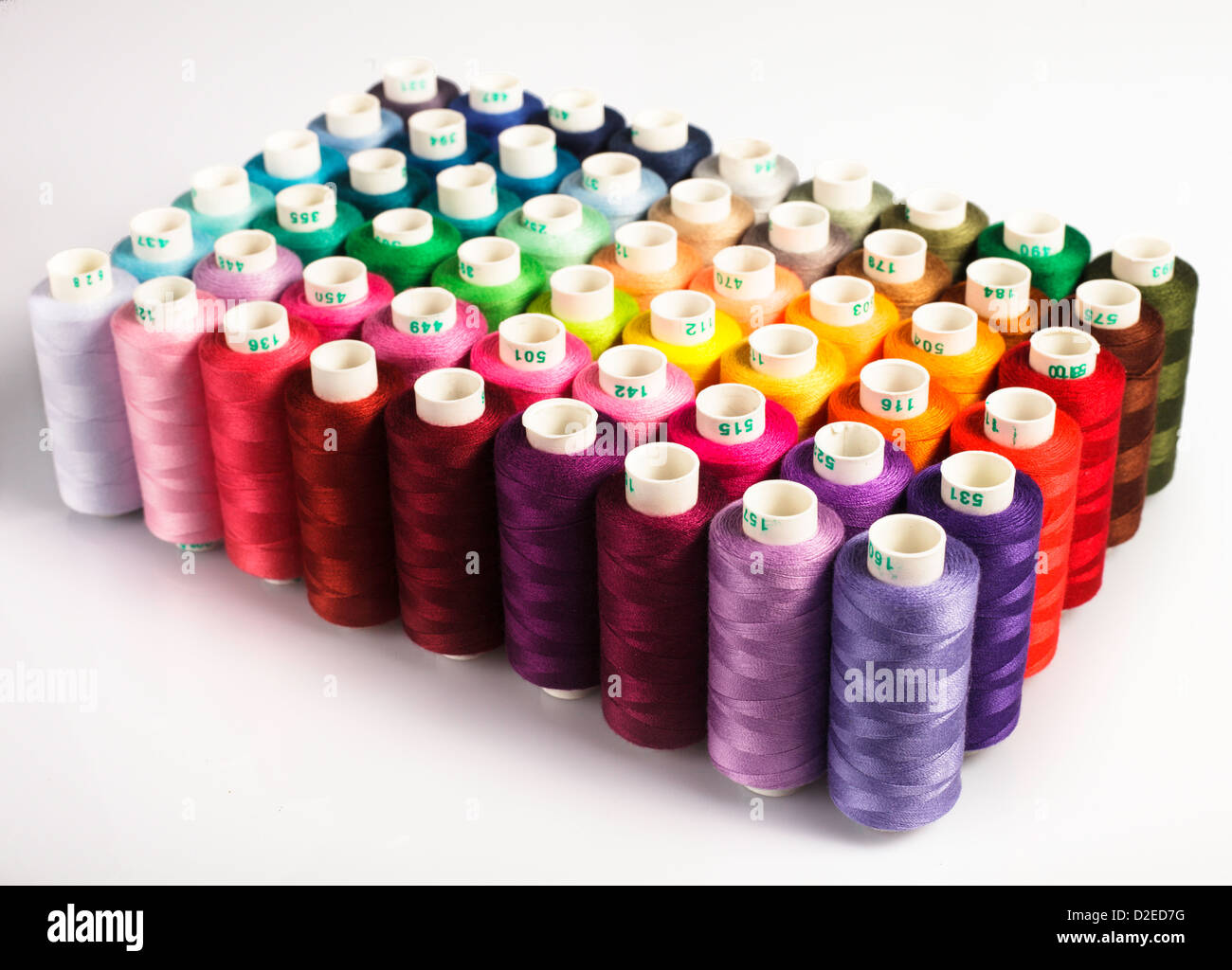 Sewing threads as a multicolored background closeup Stock Photo - Alamy
