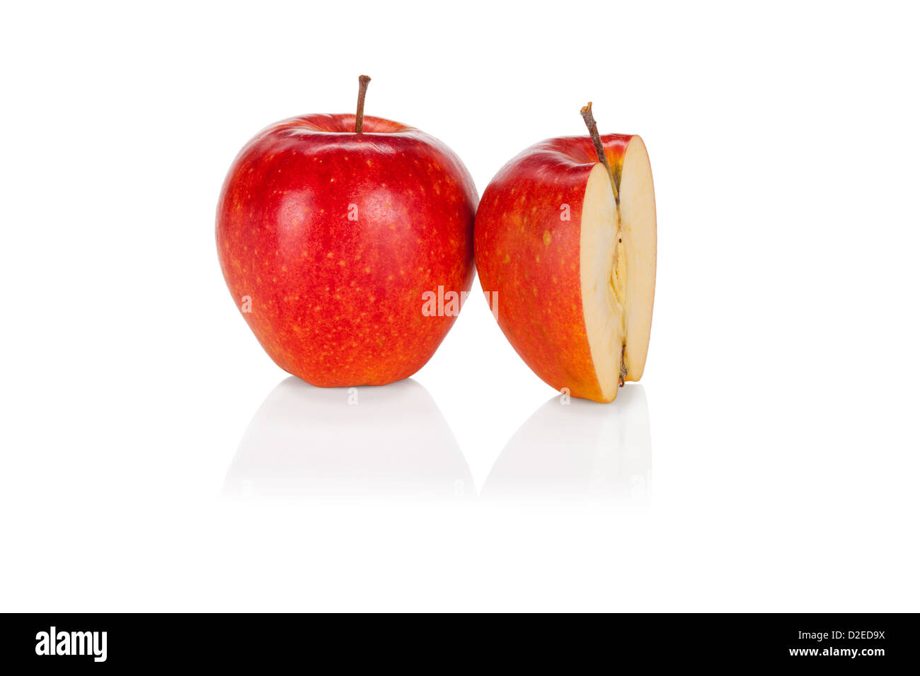 Fresh red apple and half isolated on white background Stock Photo - Alamy