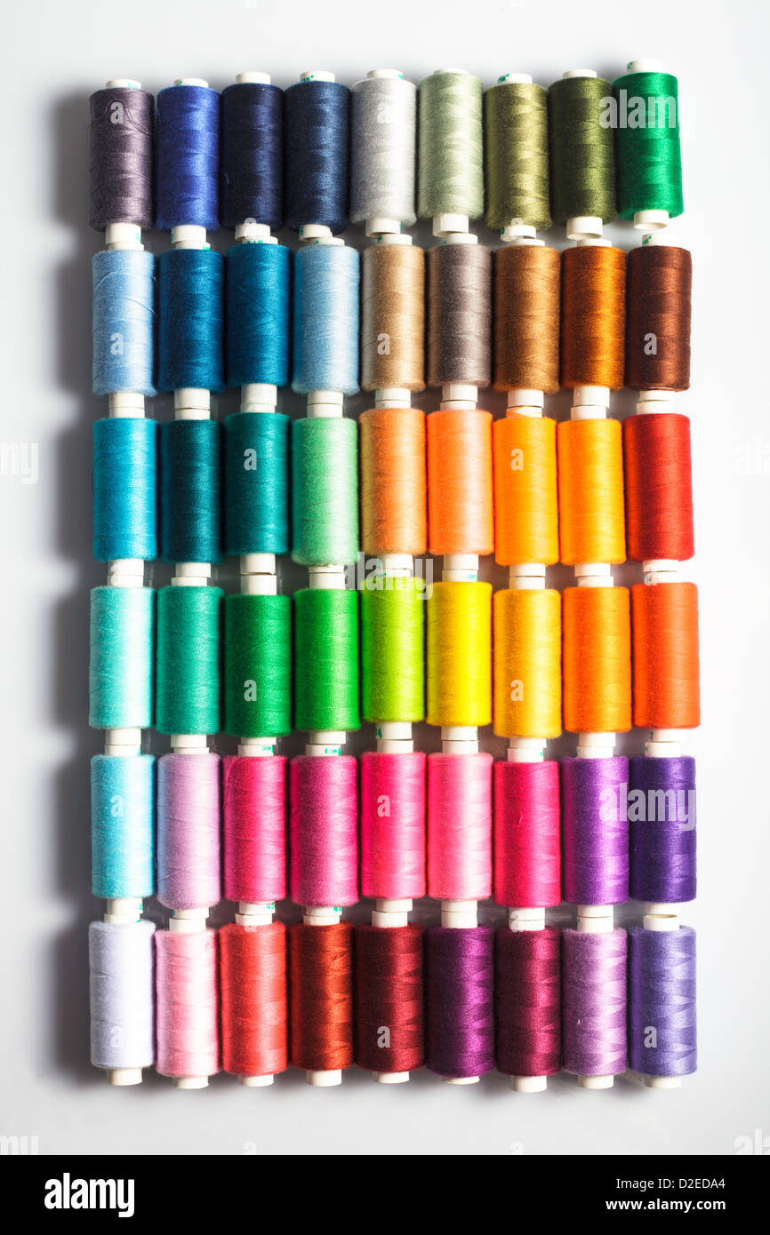 Sewing threads as a multicolored background closeup Stock Photo - Alamy