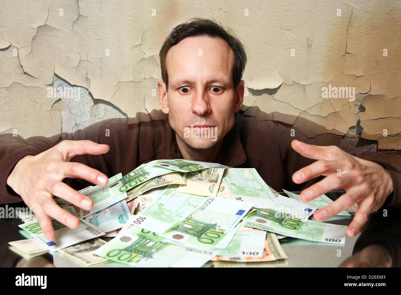 The adult the man with a heap of money Stock Photo - Alamy