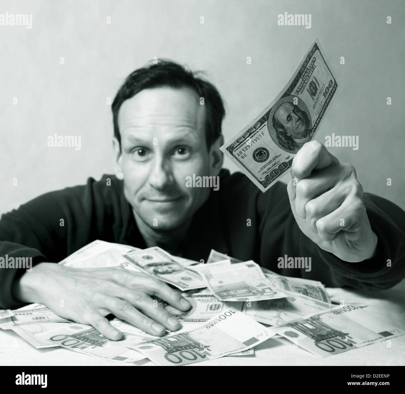 The adult the man with a heap of money Stock Photo - Alamy