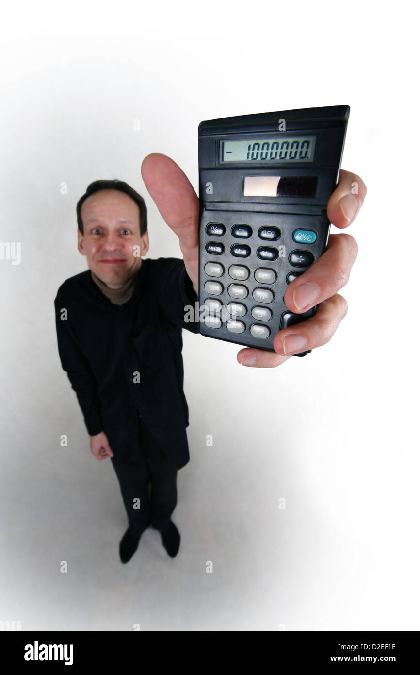 Adult man in black suit with calculator in hand on white background ...