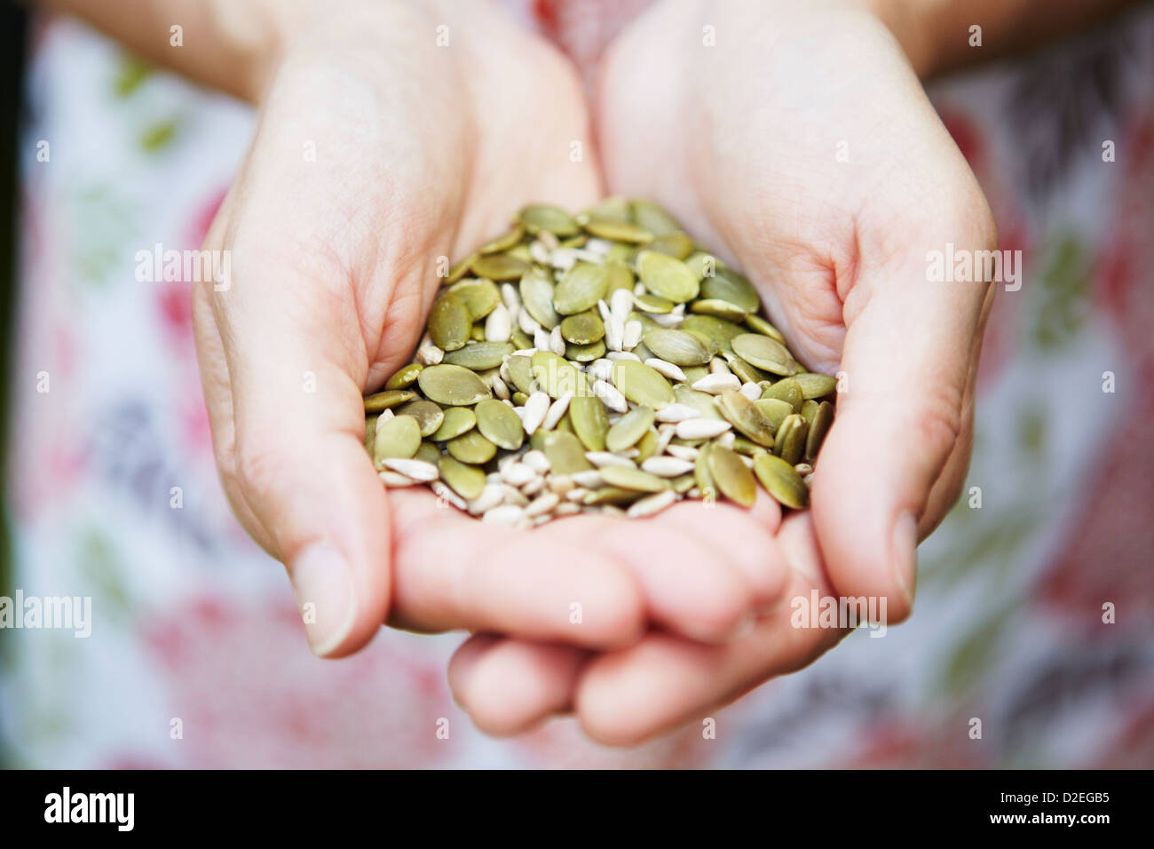 Woman Holding Handful Of Healthy Seeds Stock Photo - Alamy