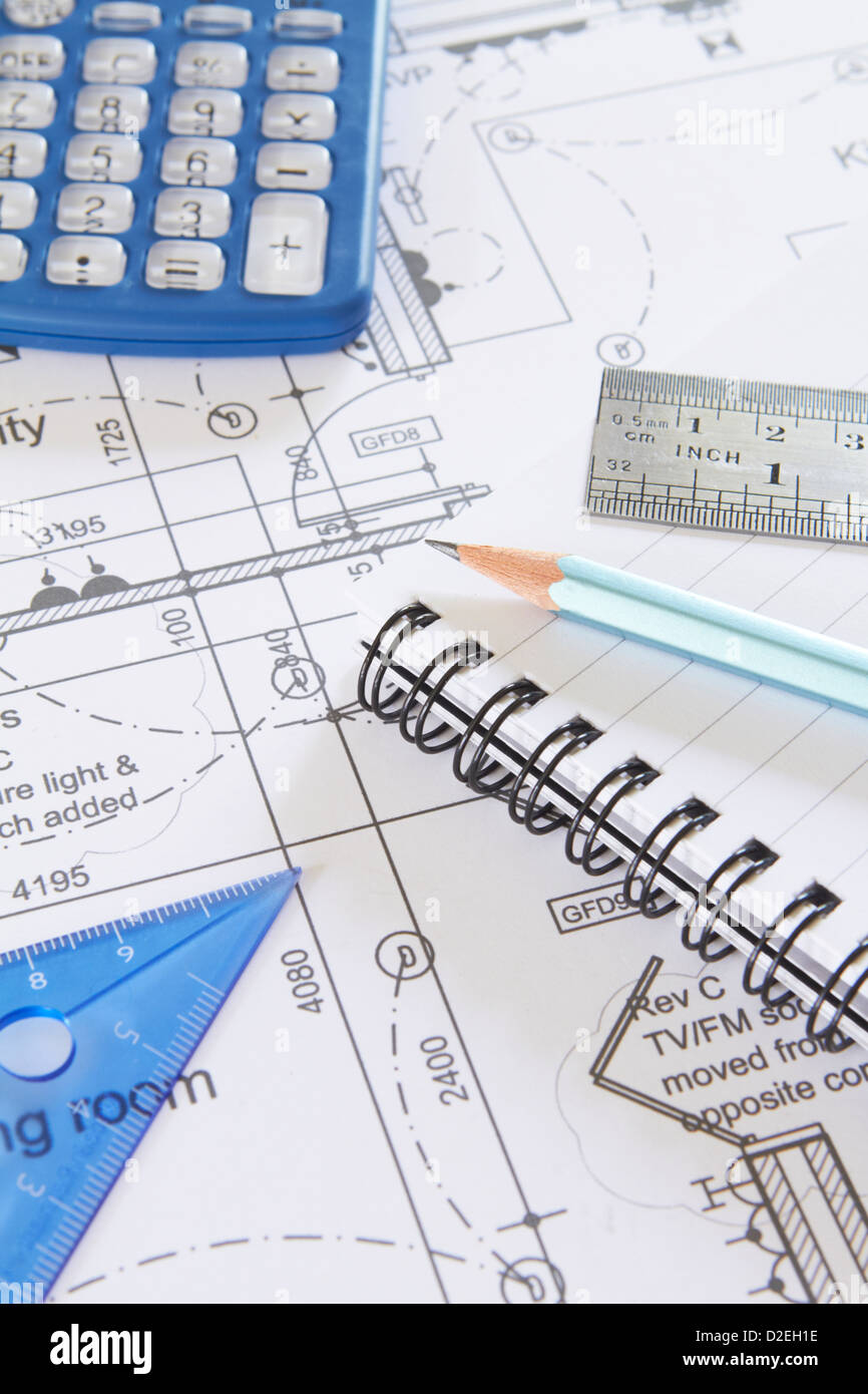 Drawing Equipment And Calculator On House Plans Stock Photo - Alamy