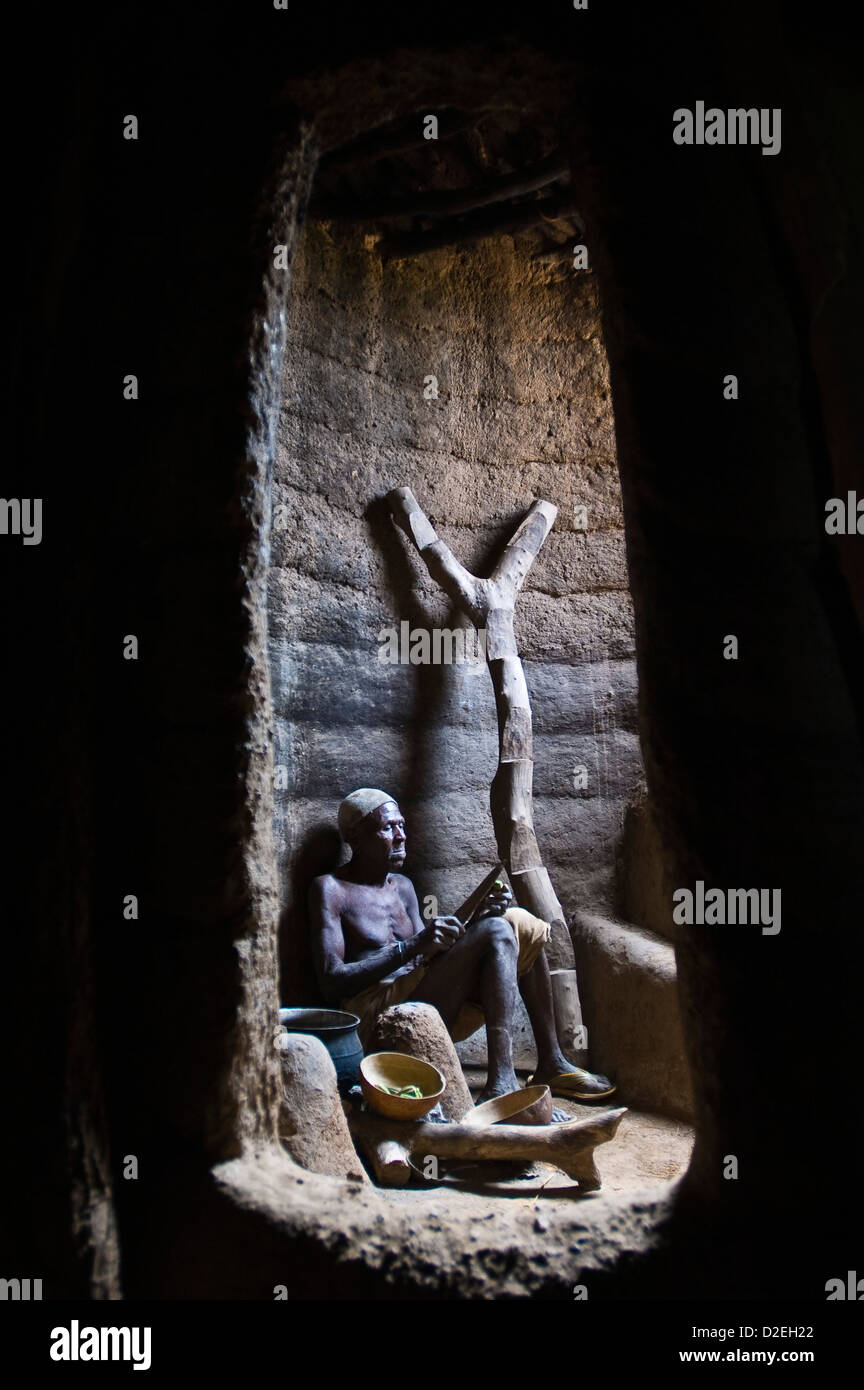 Benin, Atacora County, Koutagou, man cooking in the kitchen of a Tata ...