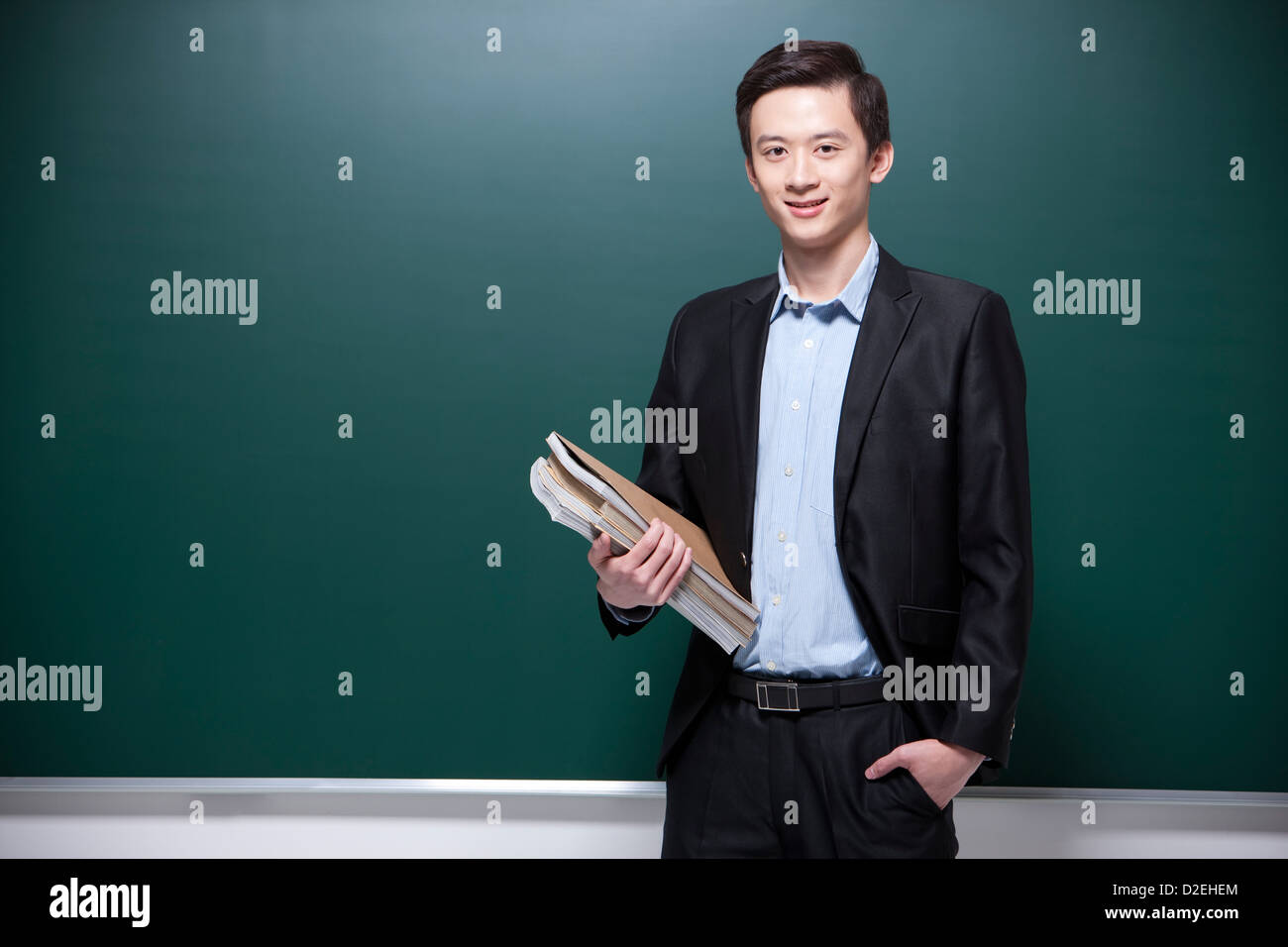 Professional male teacher in classroom Stock Photo - Alamy