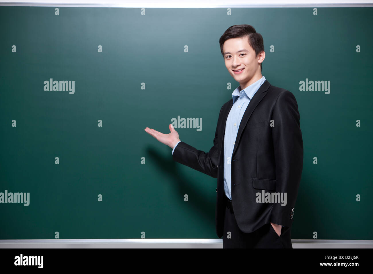 Professional male teacher in classroom Stock Photo - Alamy