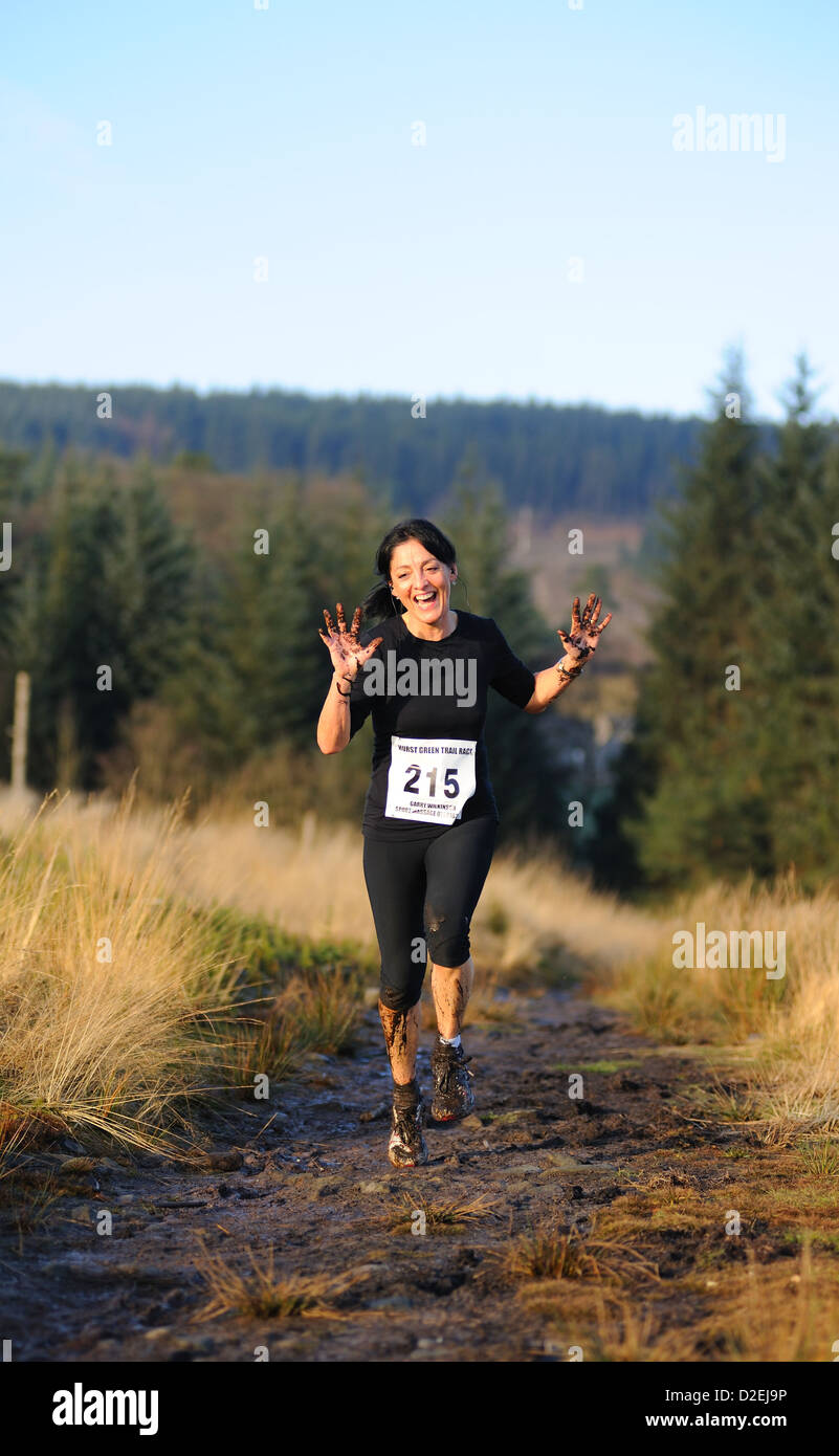 female trail runner in a trail race Stock Photo - Alamy