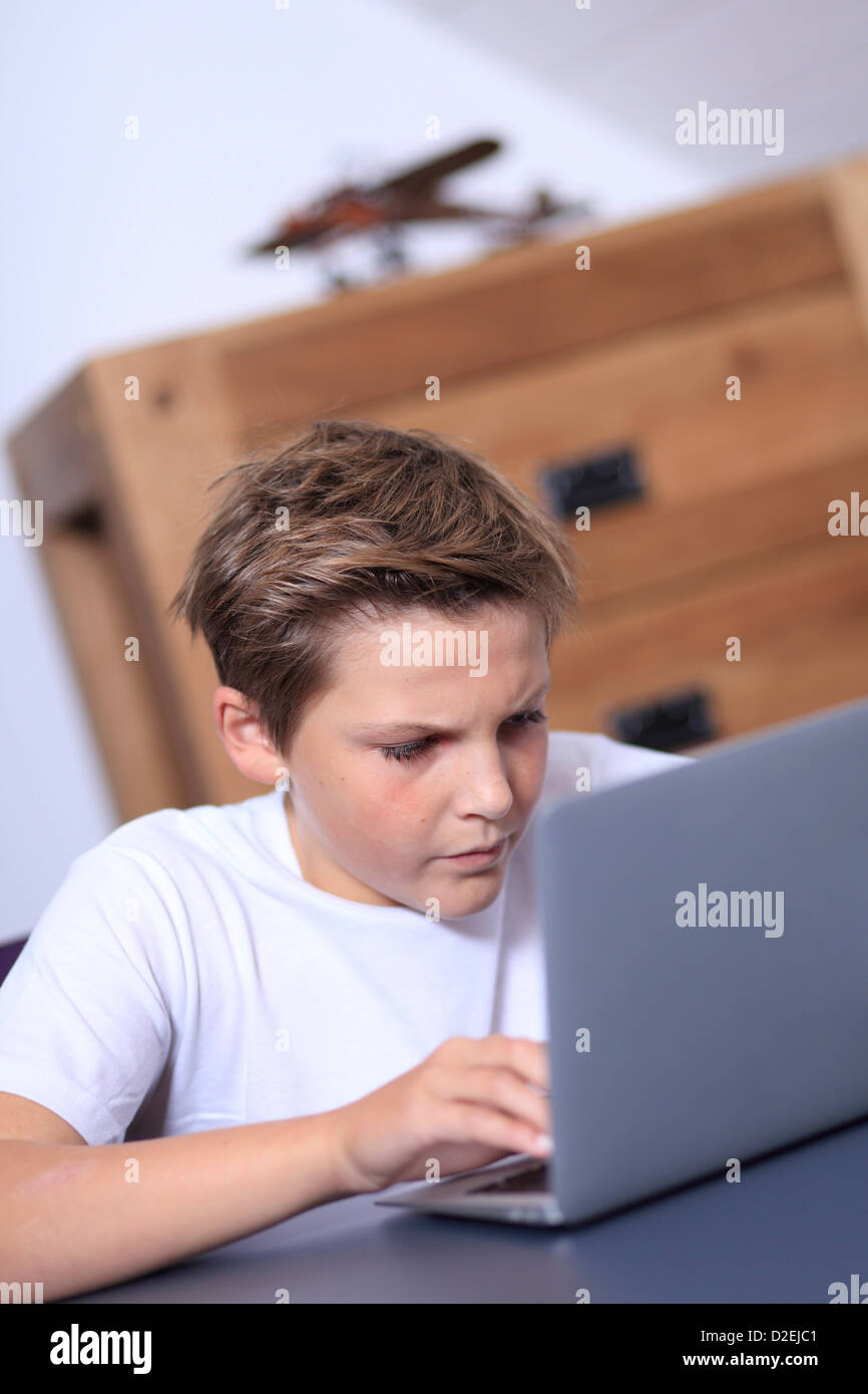 France, young boy with a computer Stock Photo - Alamy