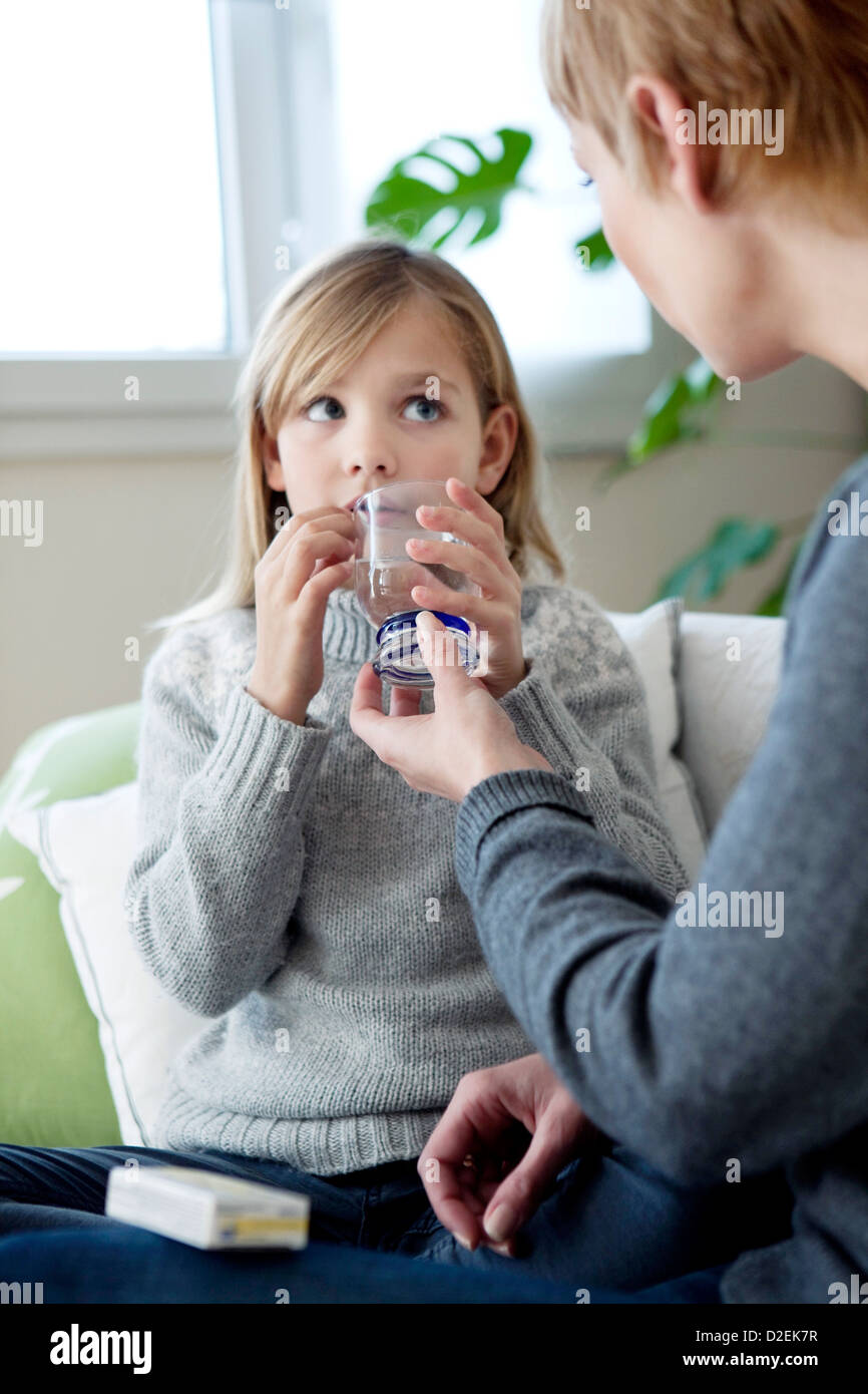 CHILD TAKING MEDICATION Stock Photo - Alamy