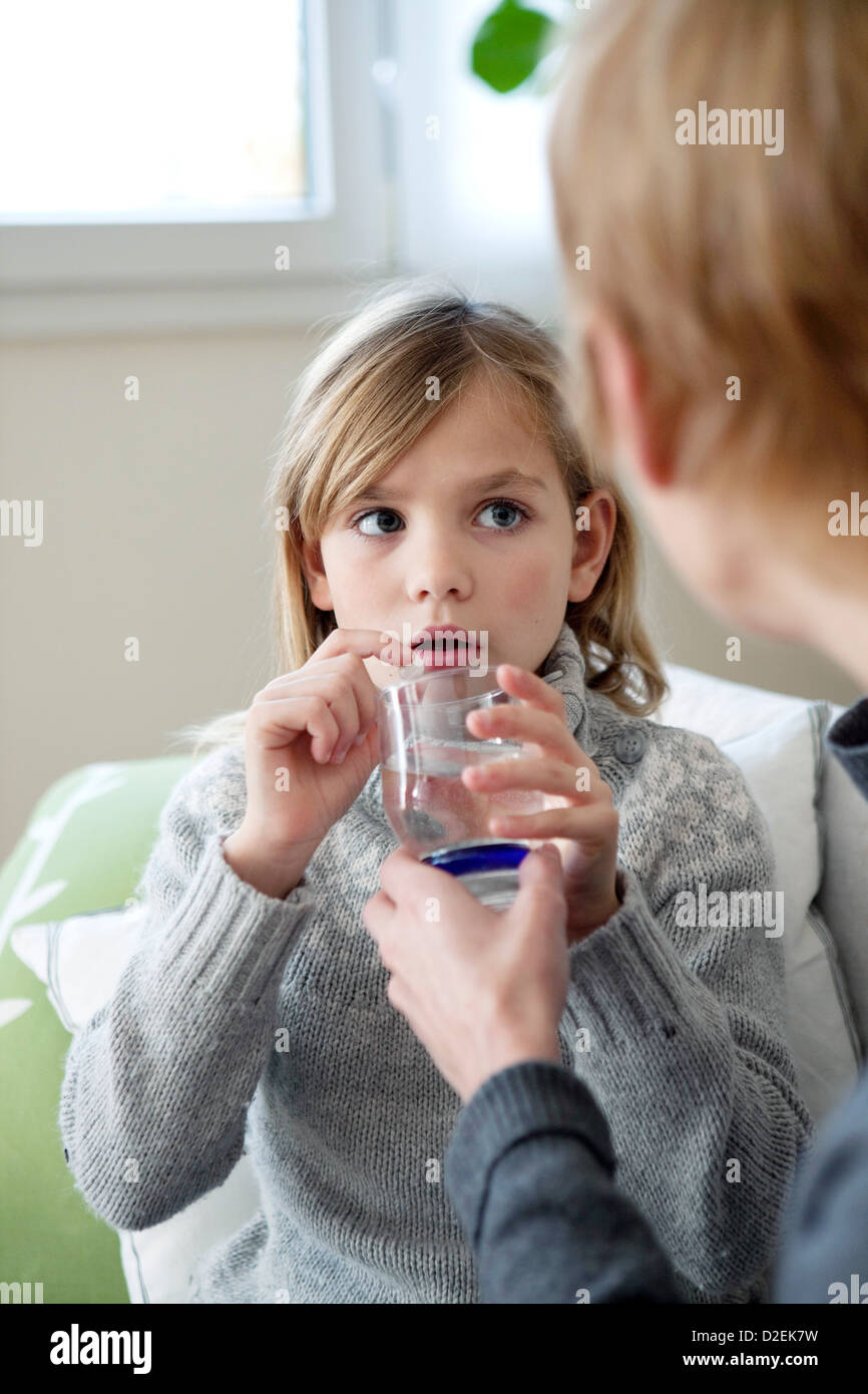 CHILD TAKING MEDICATION Stock Photo - Alamy