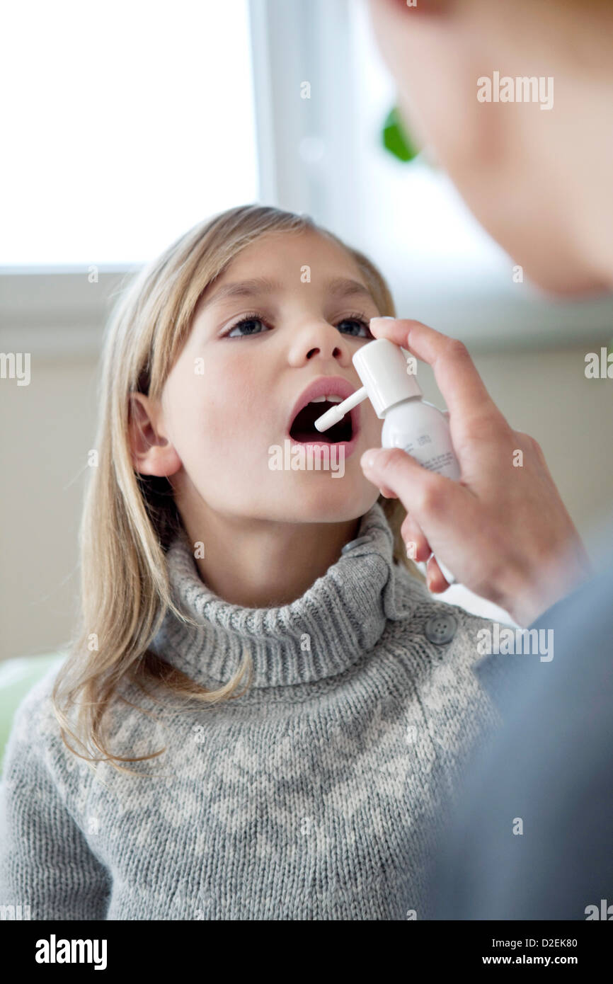 Child using spray in mouth hi-res stock photography and images - Alamy