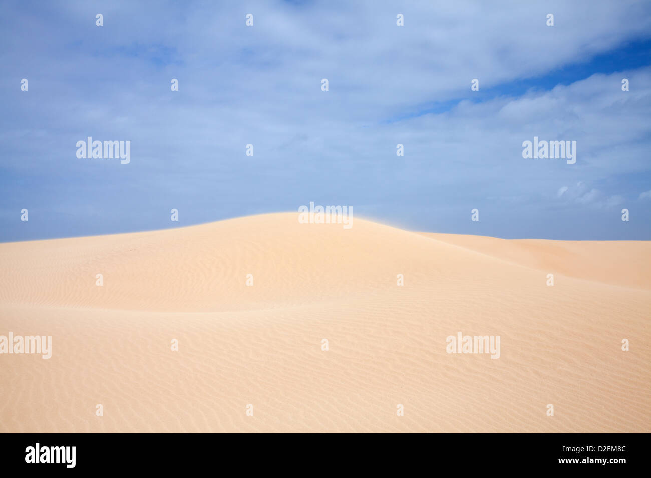 sand and sky dunes abstract, edge of the dune blurred by flying sand ...
