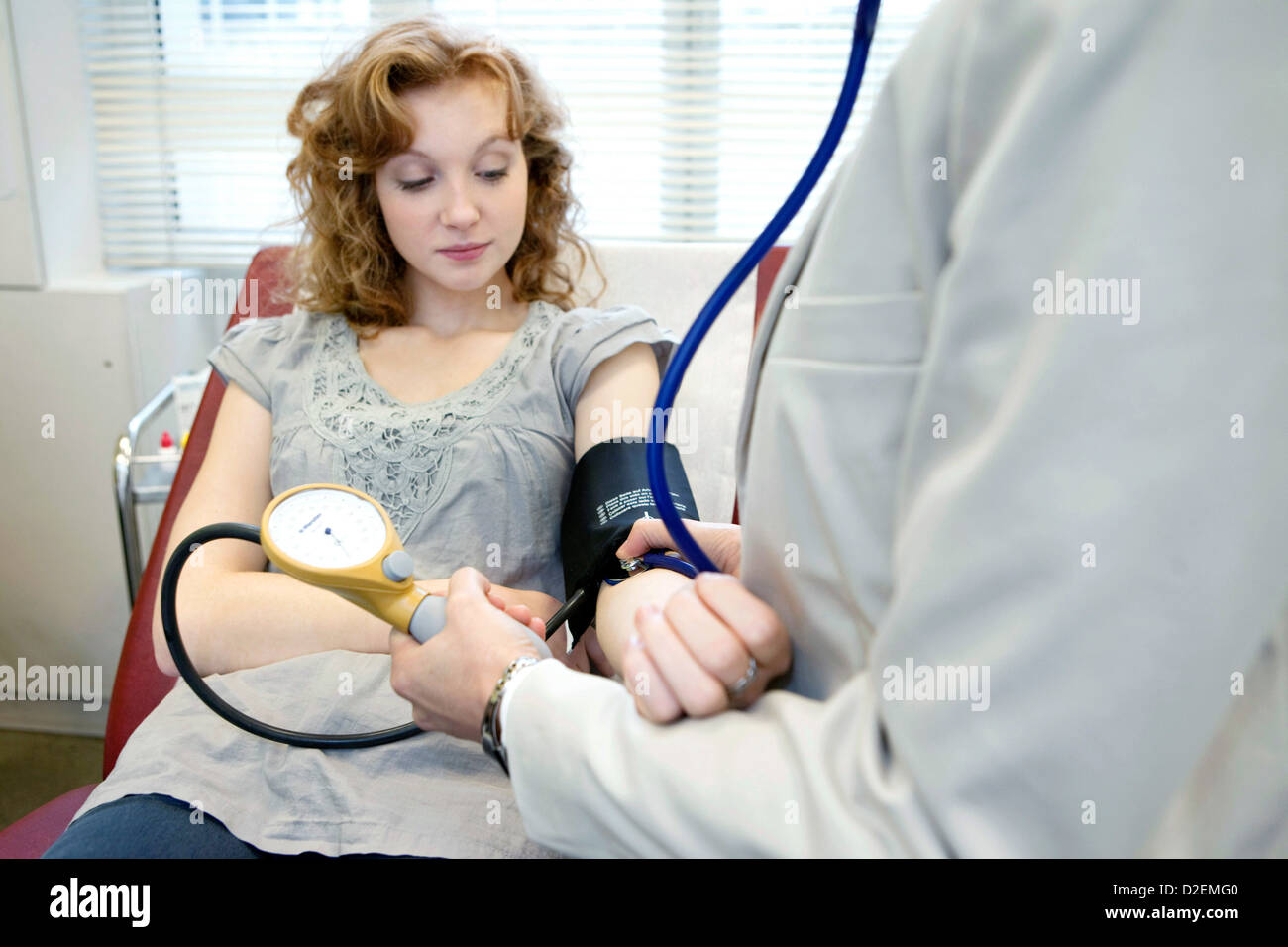 BLOOD PRESSURE, WOMAN Stock Photo - Alamy
