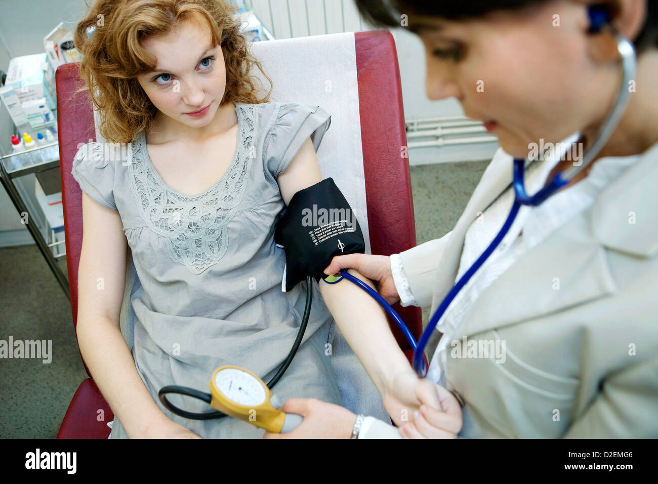 BLOOD PRESSURE, WOMAN Stock Photo - Alamy