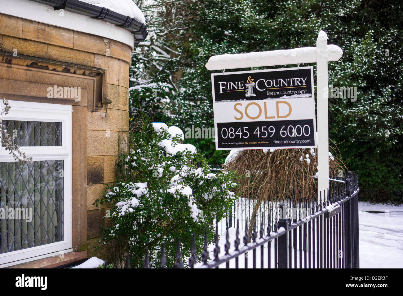 A country house sold sign in winter Stock Photo - Alamy