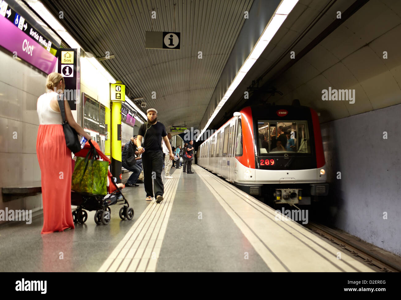 Passengers wait for the train Stock Photo - Alamy