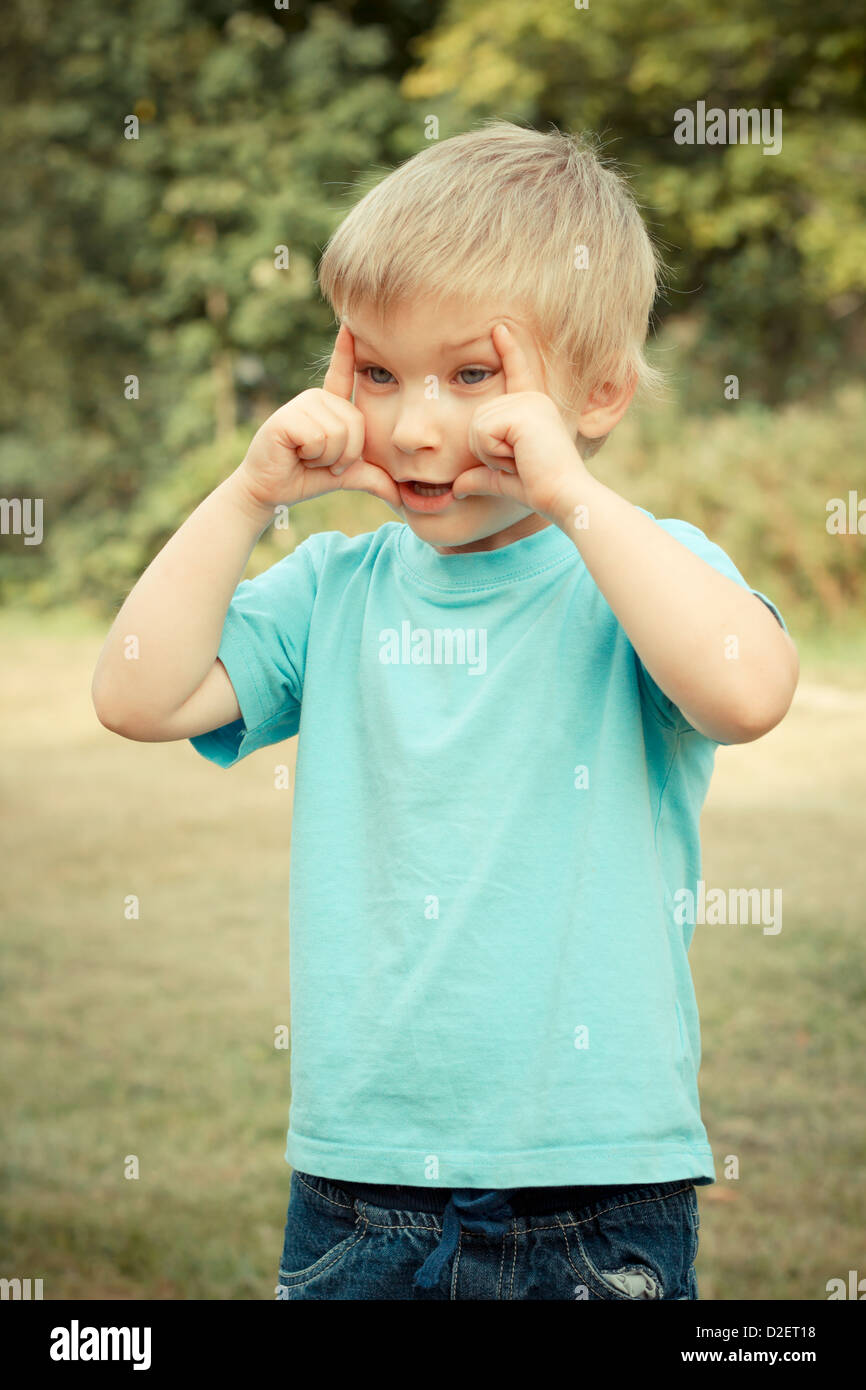 Child making funny faces hi-res stock photography and images - Alamy