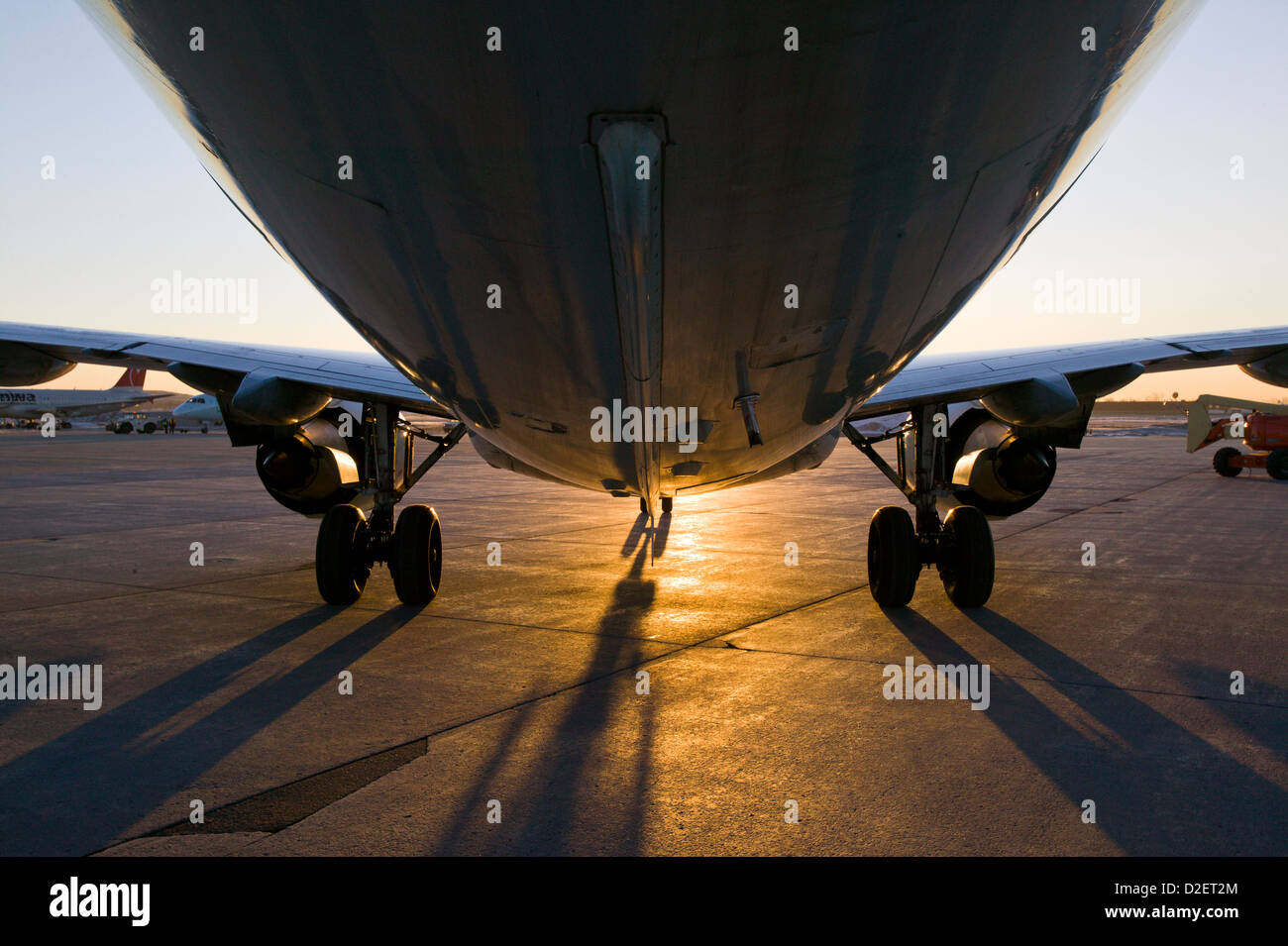 An airplane from below as the sun rises on the Montreal Airport, Quebec ...