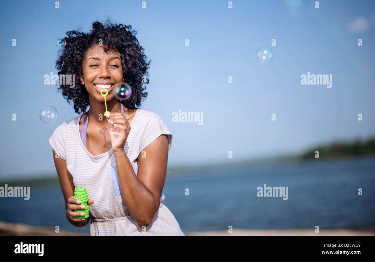 Woman Blowing Bubbles Lake