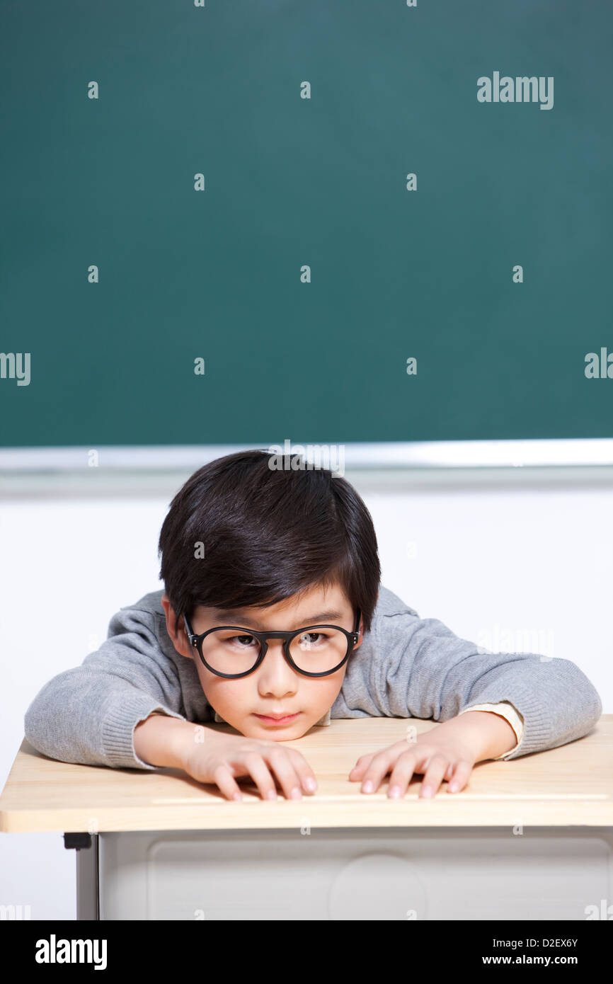 Child leaning over desk hi-res stock photography and images - Alamy