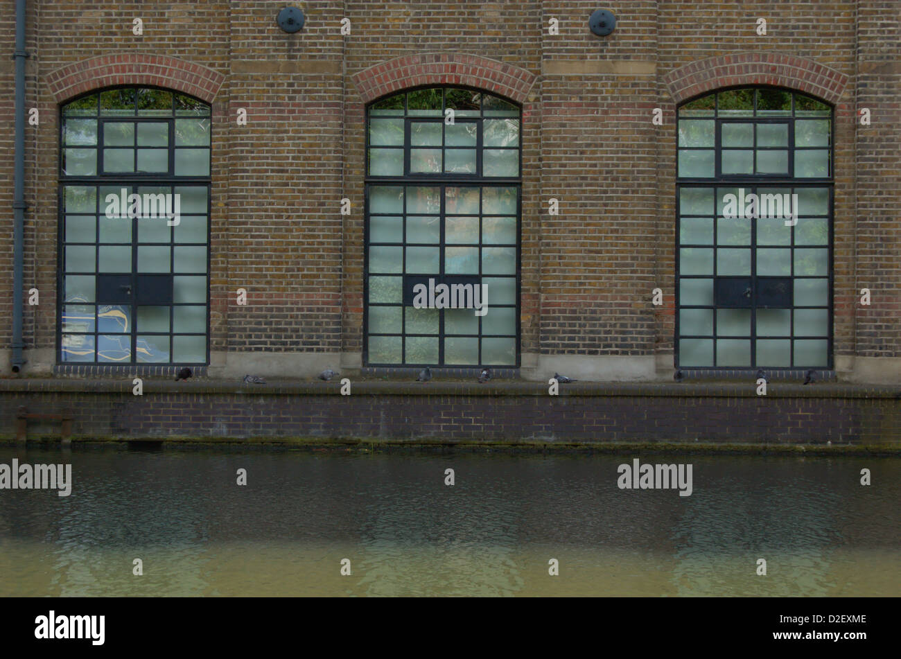 Brick warehouse conversion adjoining the Regents Canal in London ...