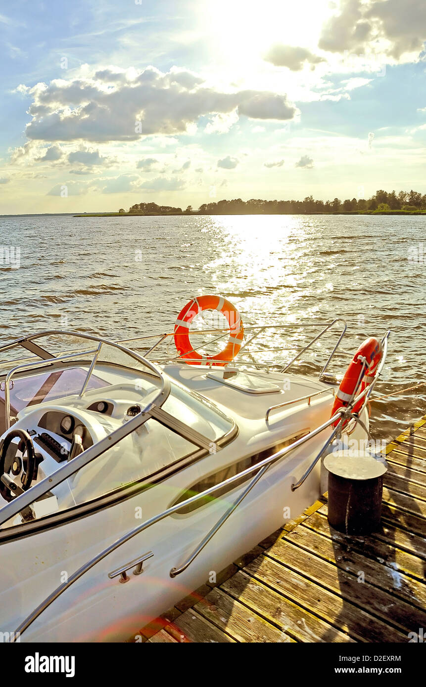 An image of boat docked at the wharf Stock Photo - Alamy