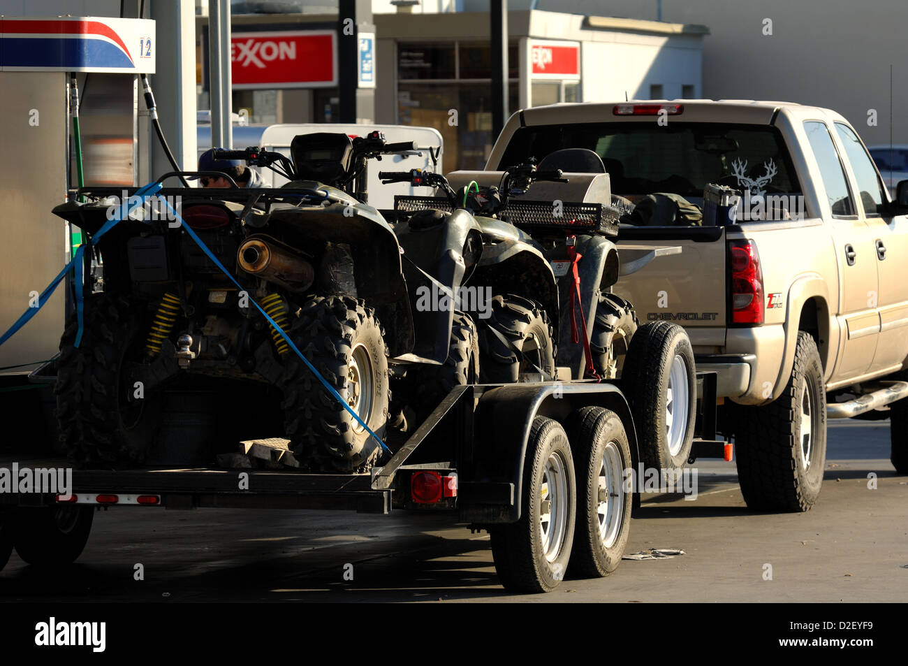 Deer hunters with ATV's in their truck, buying gas at Llano Texas Stock ...