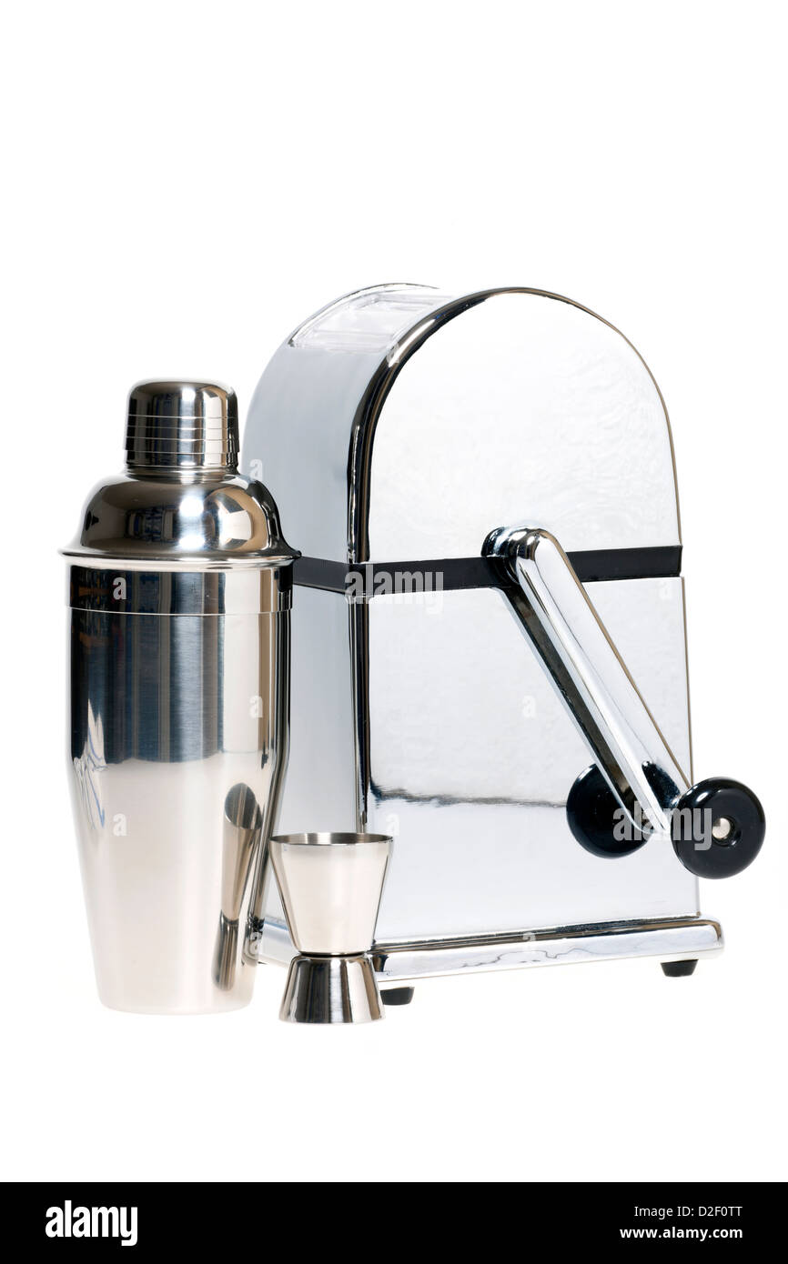 Glossy ice crusher and a shaker with measuring cup front of white ...
