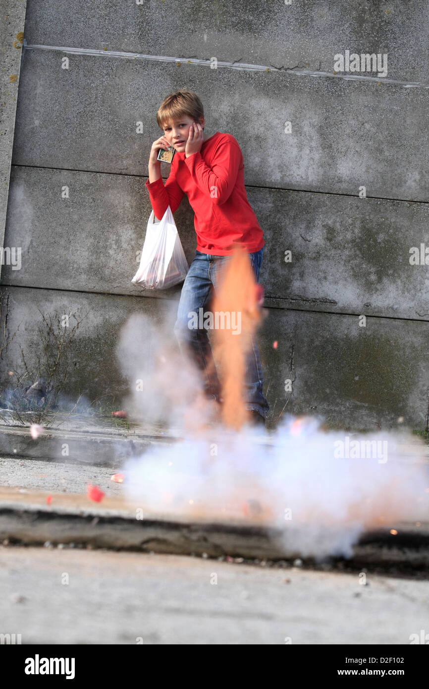 France, young boy playing with firecrackers Stock Photo - Alamy