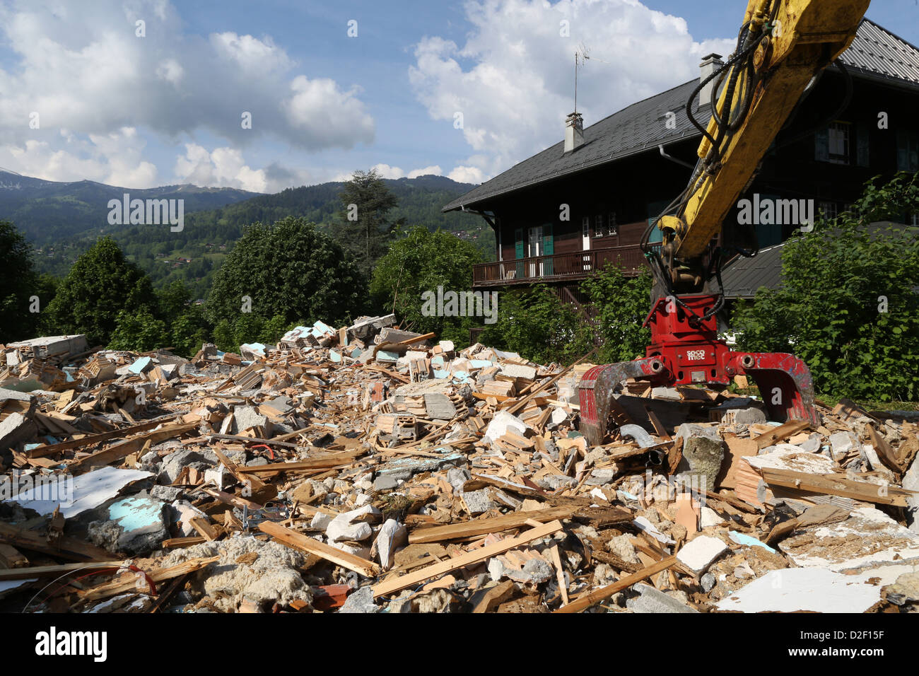 Demolition house with backhoe Stock Photo - Alamy