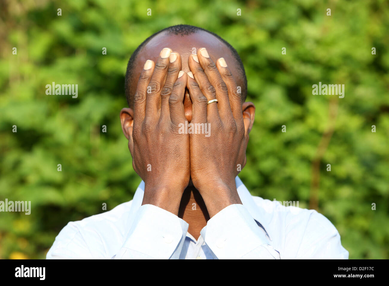 Man hiding his face France Stock Photo - Alamy