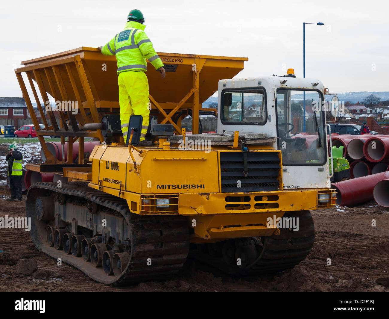 An operator on a Mitsubishi LD1000c rubber tracked dumper fitted with a ...