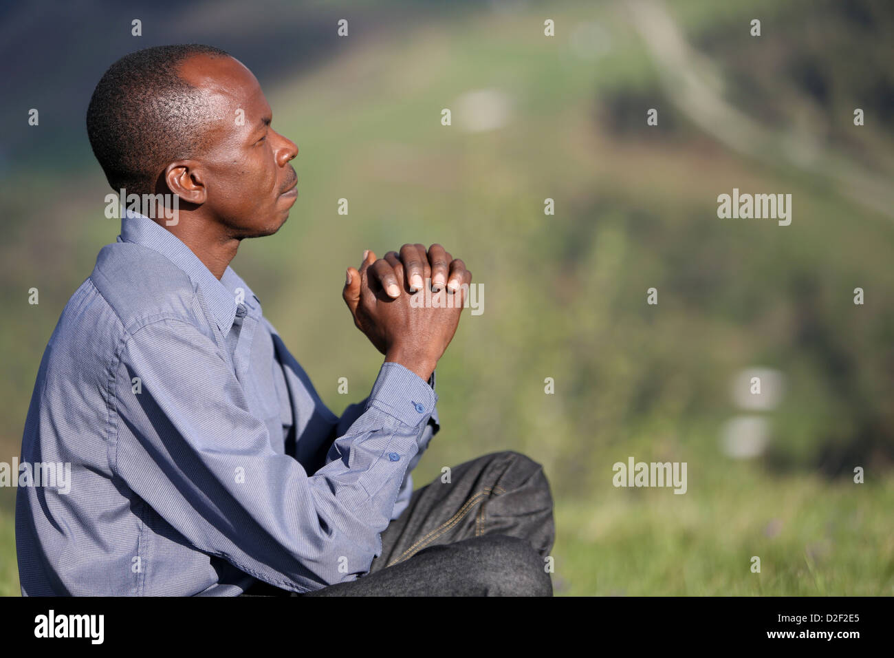 Man praying outside. France Stock Photo - Alamy