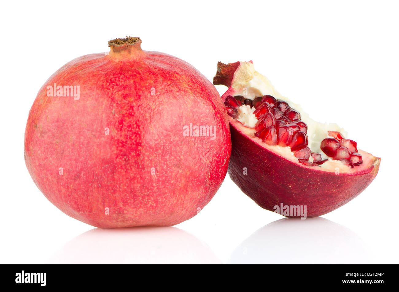 Open pomegranate with seed on white background Stock Photo - Alamy